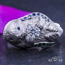 Carved Otter Ring With Emerald And Sapphire Waves